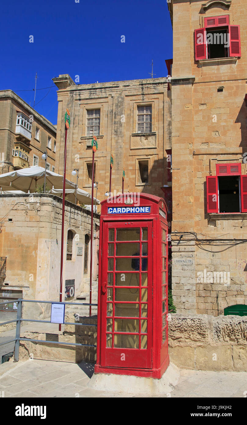 Red telephone box booth in historic city centre of Valletta, Malta ...