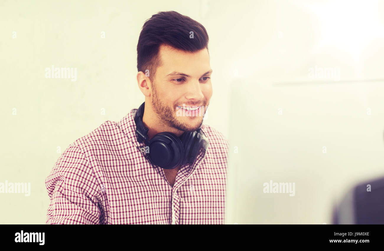 creative man with headphones and computer Stock Photo - Alamy