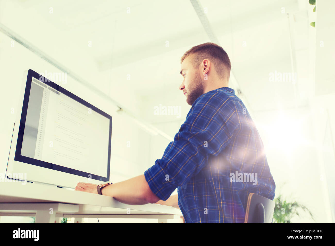 creative man or programmer with computer at office Stock Photo - Alamy