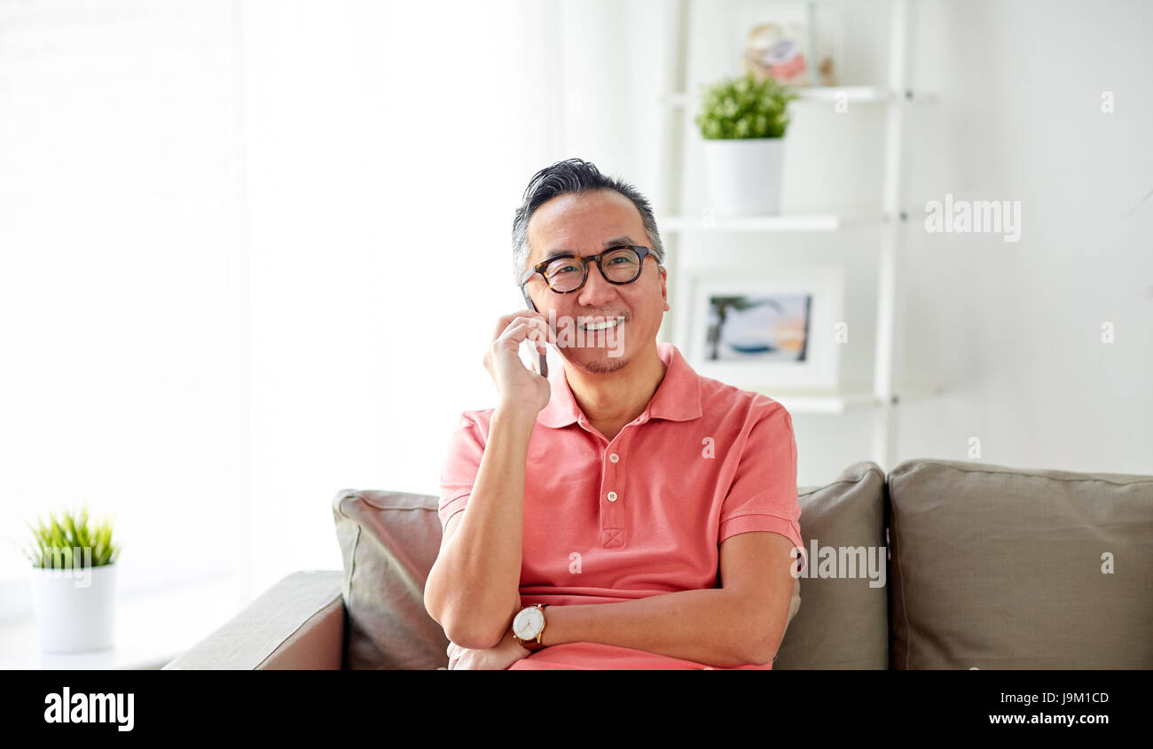 happy man calling on smartphone at home Stock Photo - Alamy