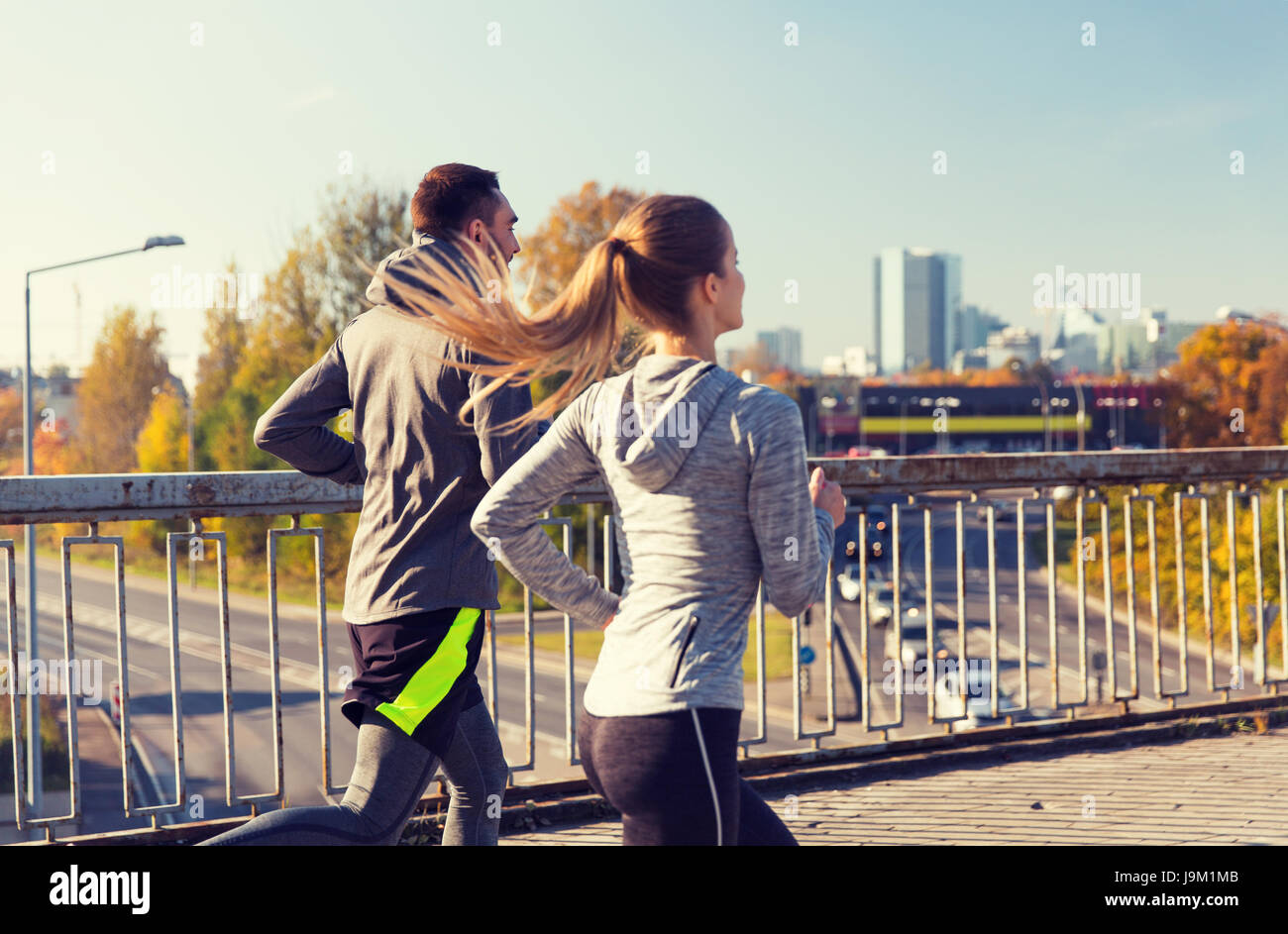 happy couple running outdoors Stock Photo - Alamy