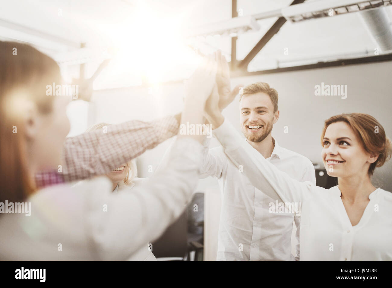 Team high five hi-res stock photography and images - Alamy