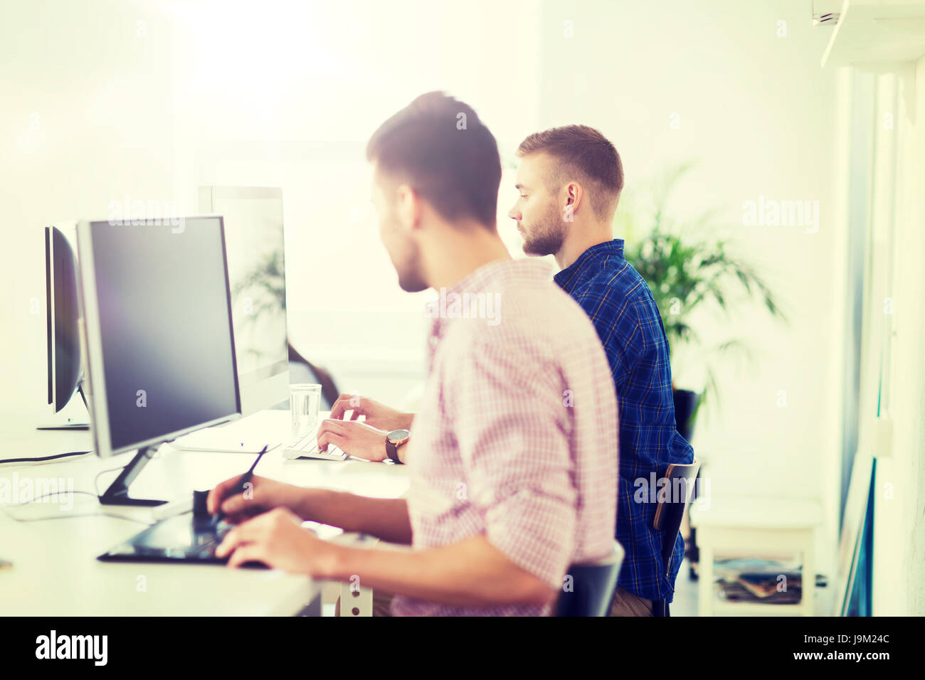 creative man or student with computer at office Stock Photo - Alamy