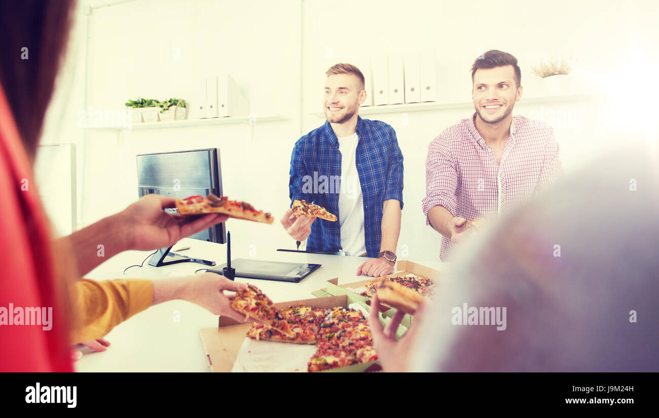 happy business team eating pizza in office Stock Photo - Alamy