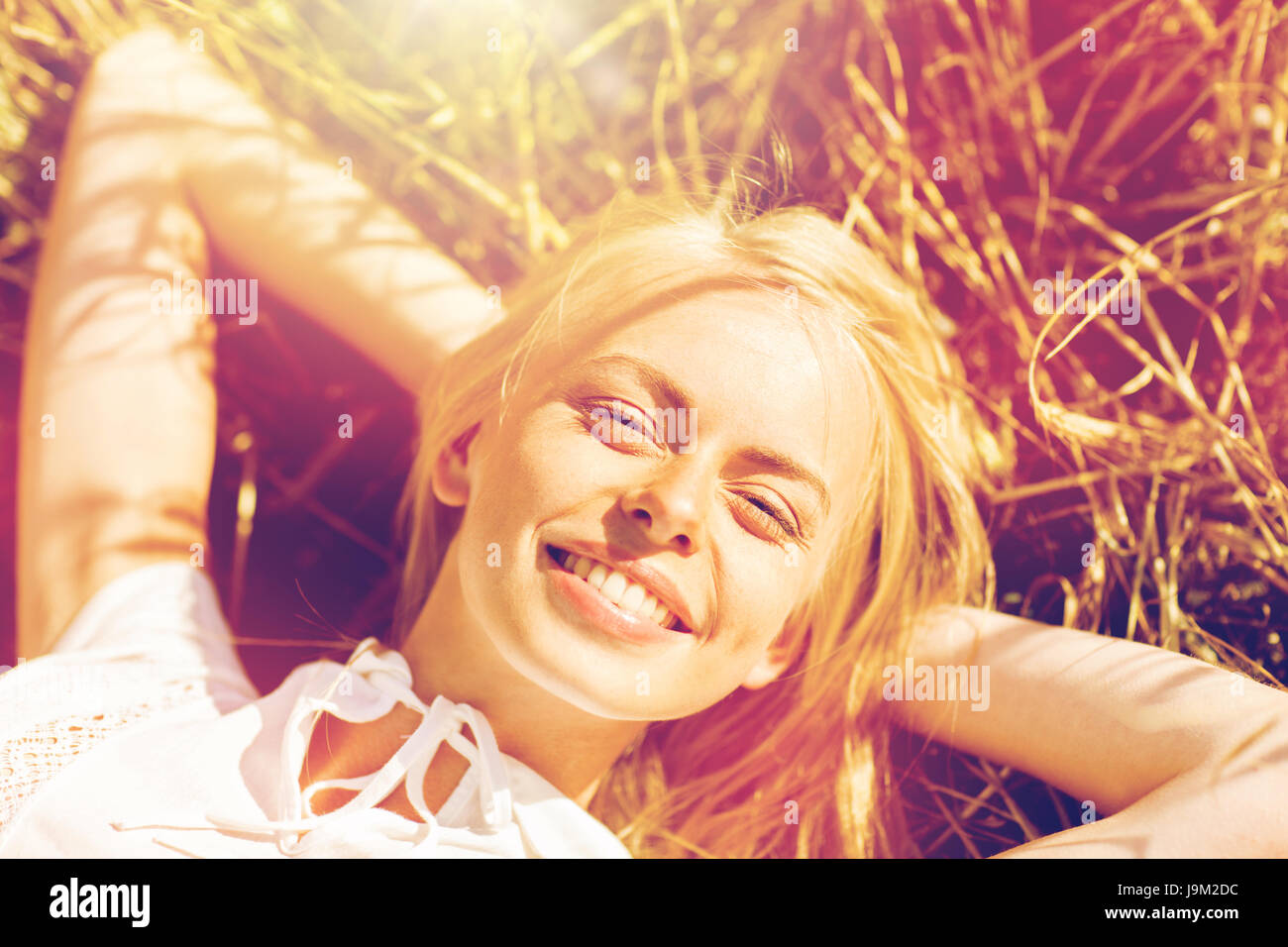 Teen girl lying on field hi-res stock photography and images - Alamy