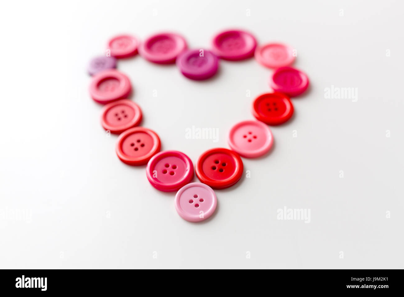 heart shape of sewing buttons Stock Photo - Alamy