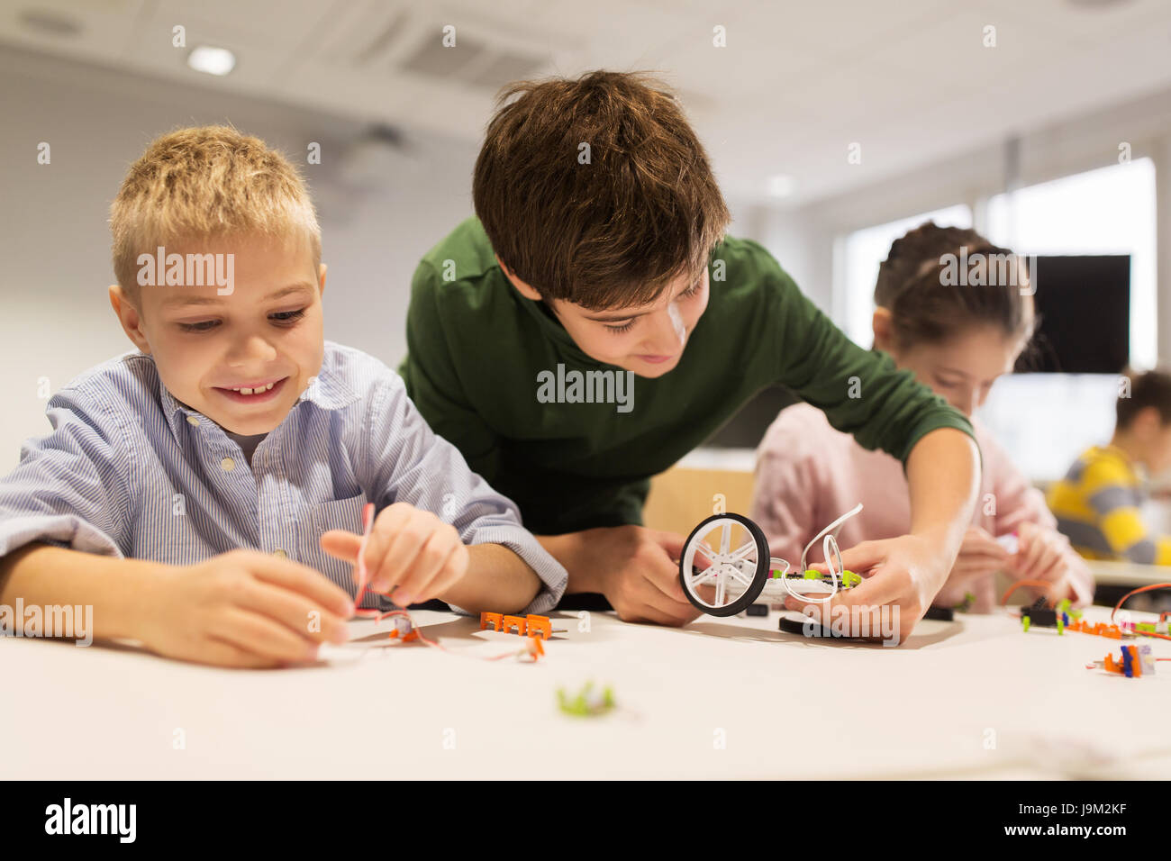 happy children building robots at robotics school Stock Photo - Alamy
