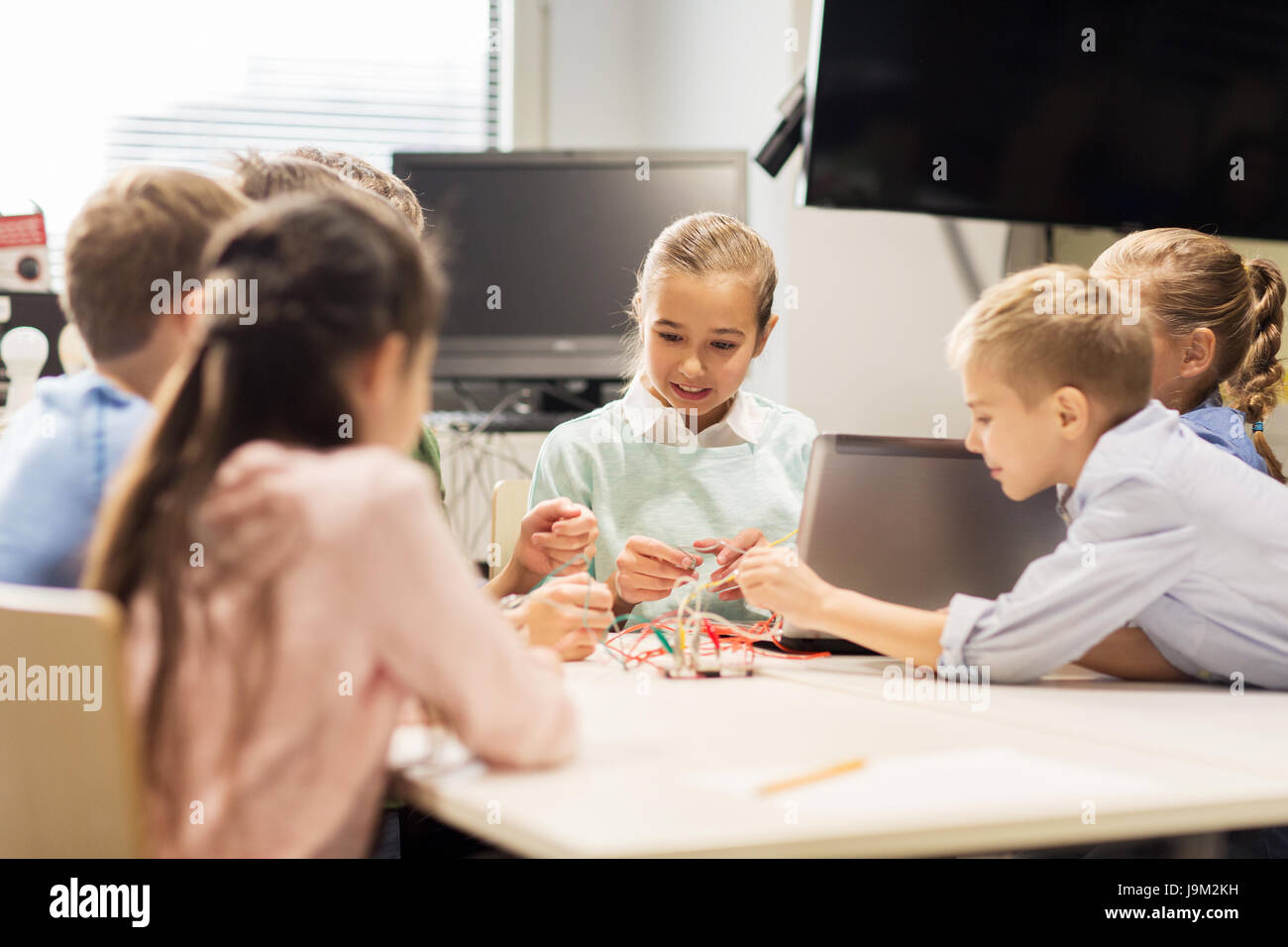 happy children with laptop at robotics school Stock Photo - Alamy