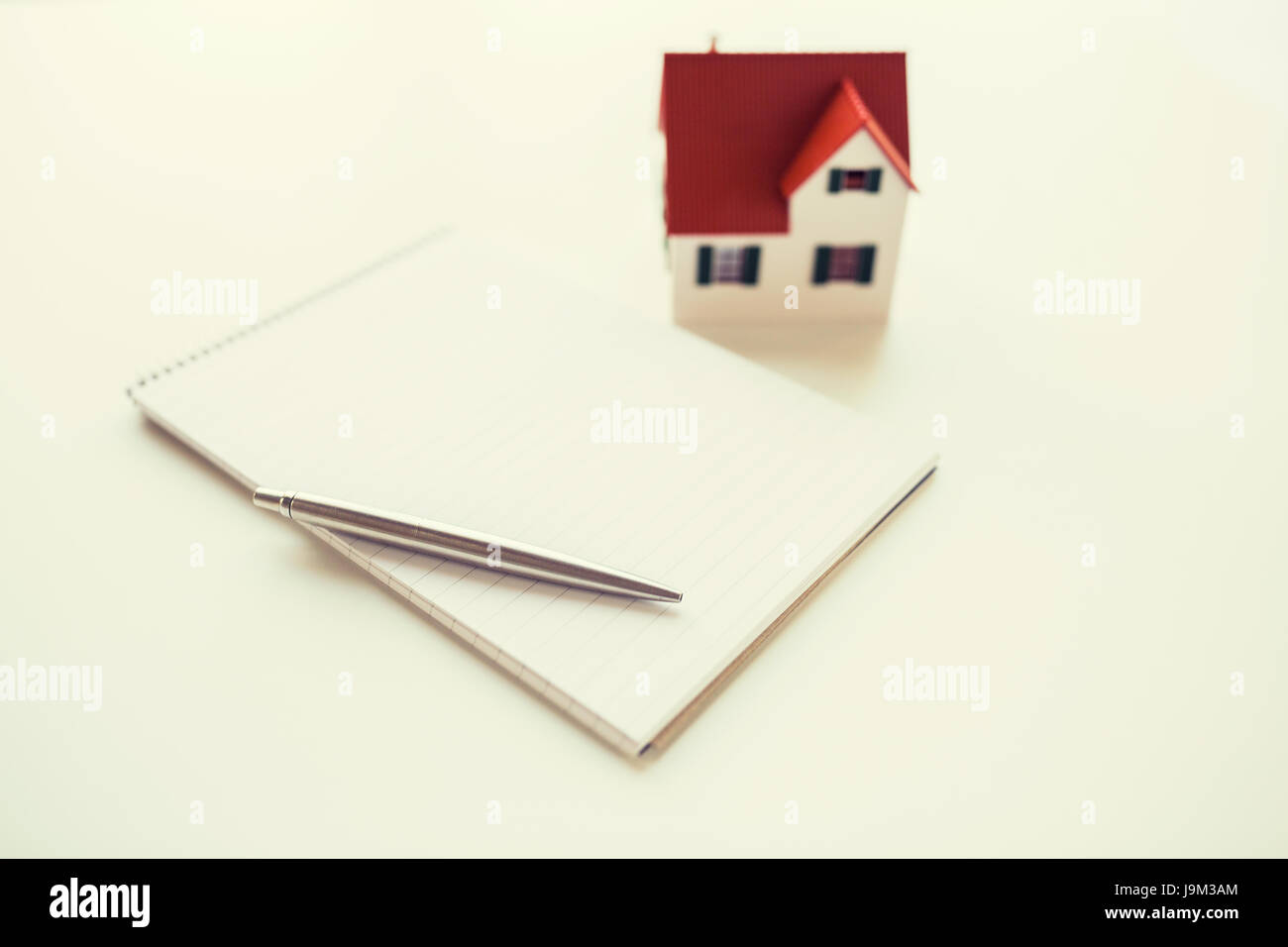 close up of house model, notebook and pencil Stock Photo - Alamy