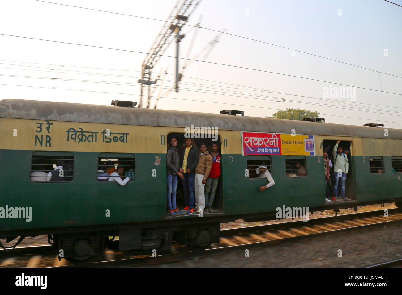 People hanging out of train india hi-res stock photography and images ...