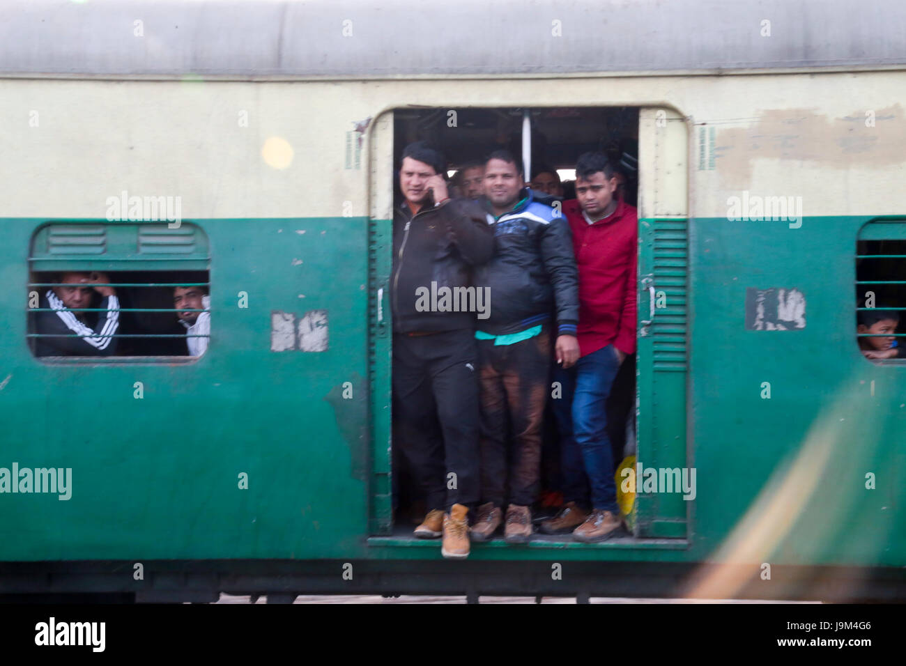 People hanging out of train hi-res stock photography and images - Alamy