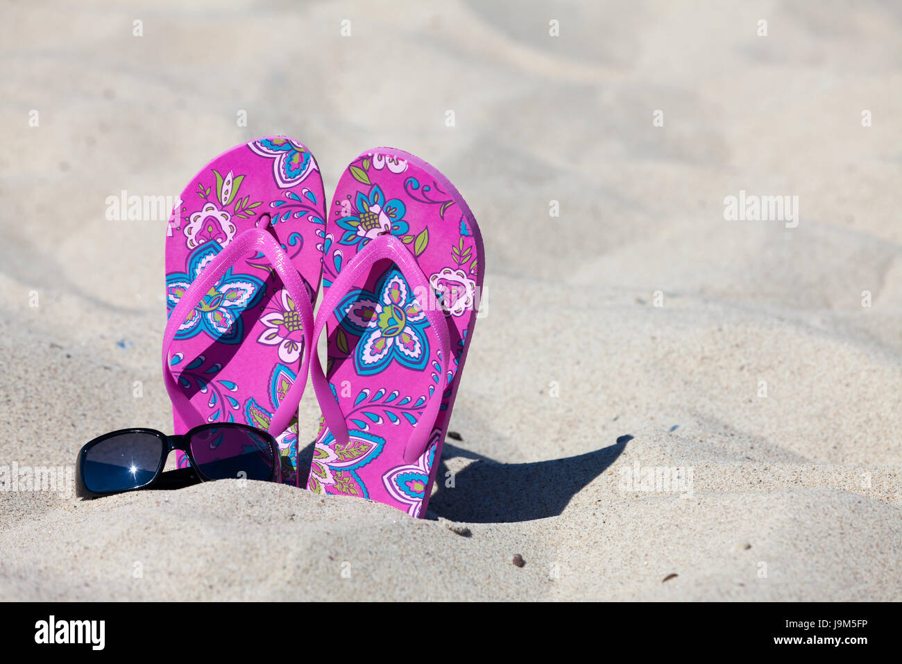 flip-flops and sunglasses on the beach Stock Photo - Alamy