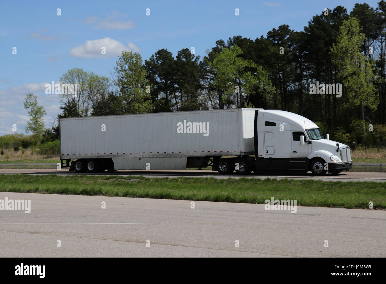 Large Semi-Truck (Lorry) traveling down a rural American Highway. Most ...