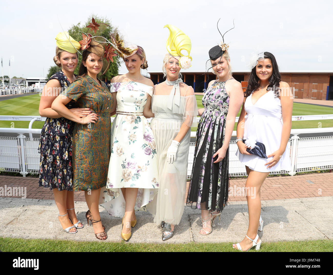 Female racegoers pose for a photograph on Ladies Day during the 2017 ...