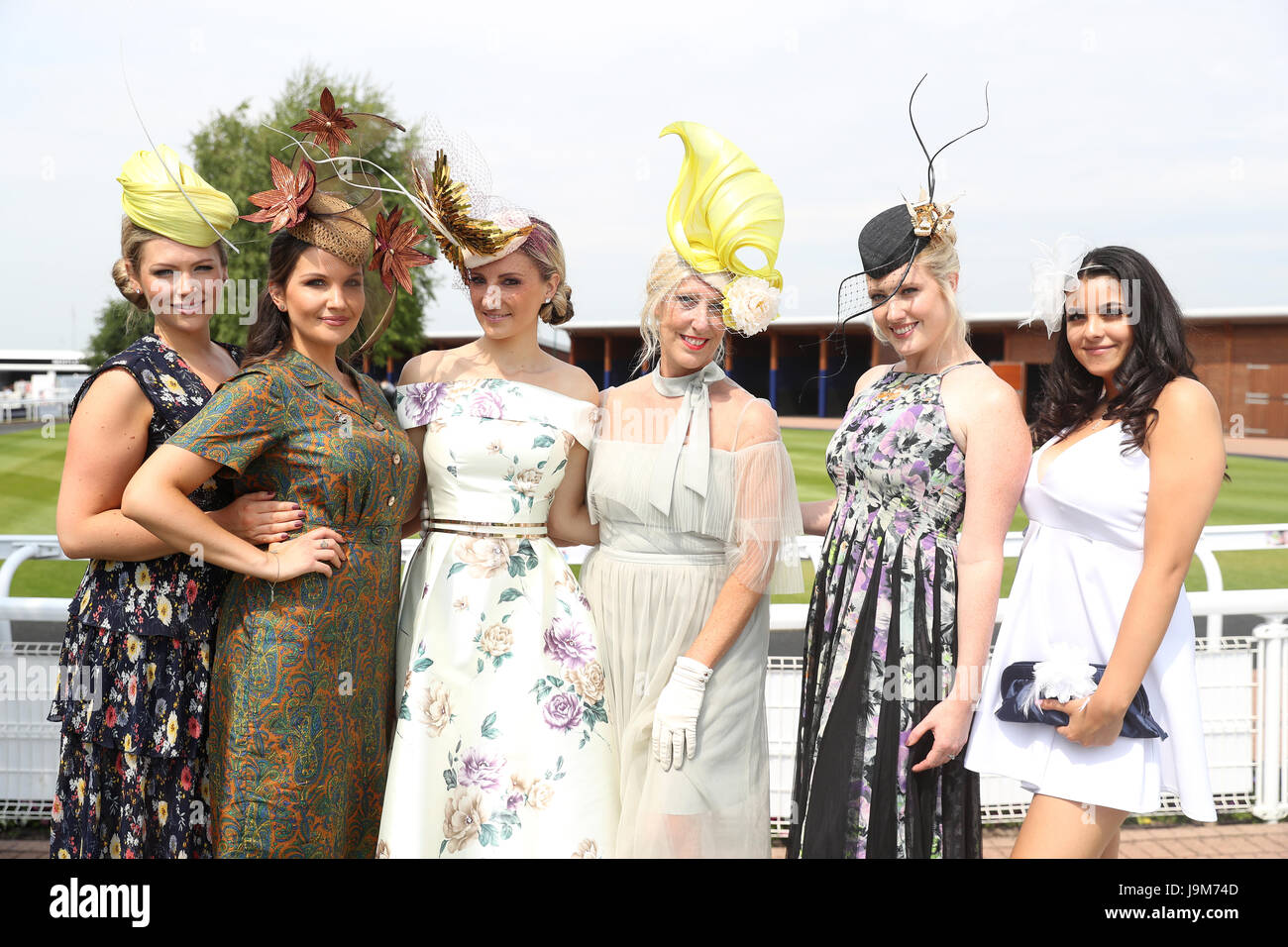 Female racegoers pose for a photograph on Ladies Day during the 2017 ...
