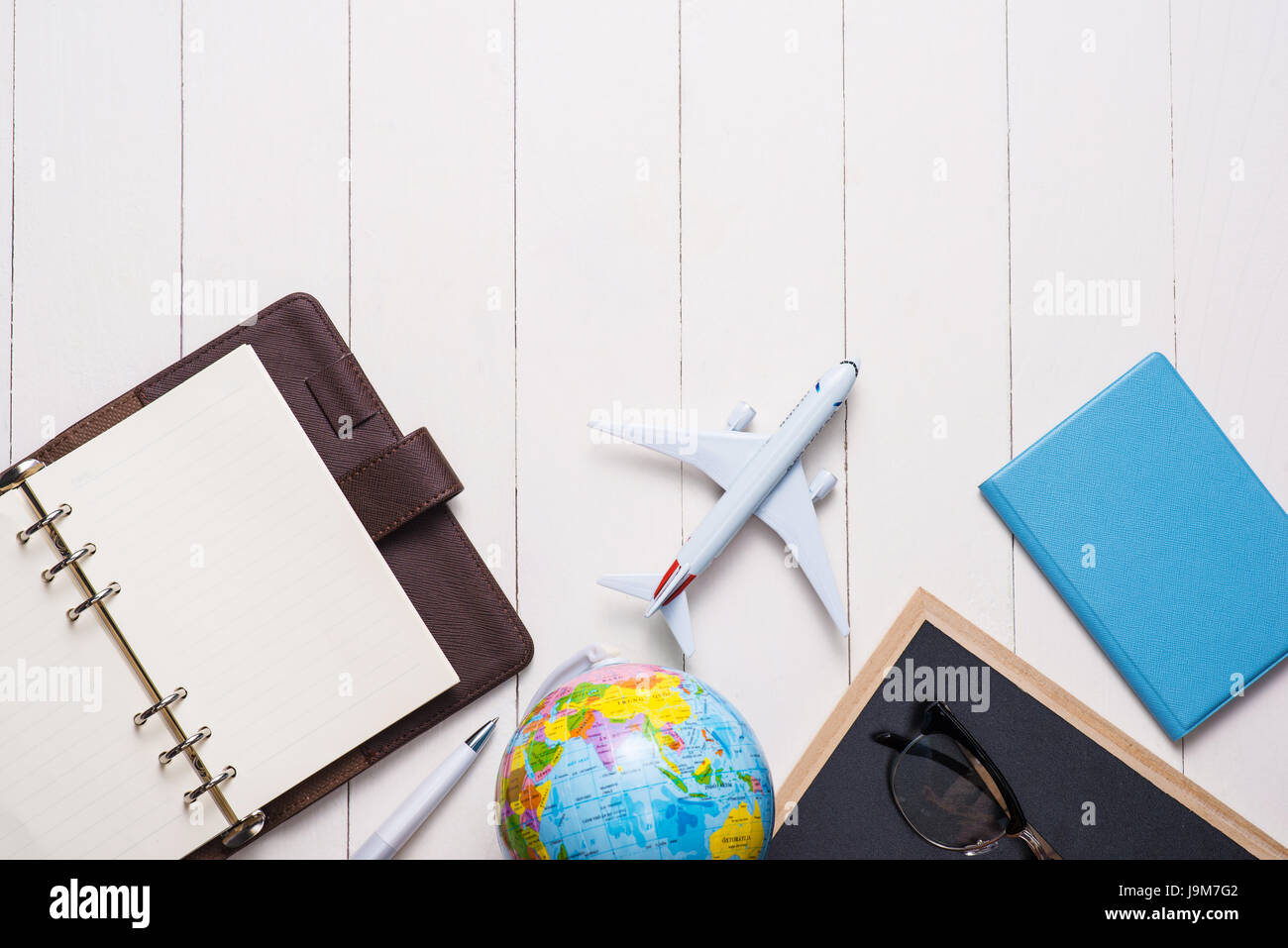Business trip concept. Airplane and blank open notebook for your text ...