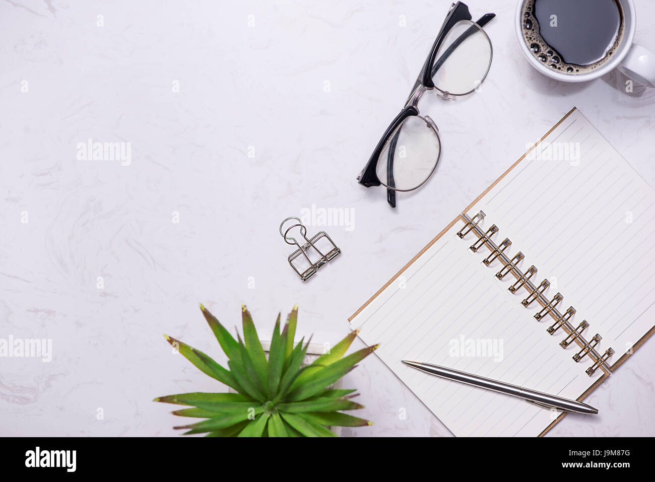 Flat lay, top view of open notebook and other supplies Stock Photo - Alamy