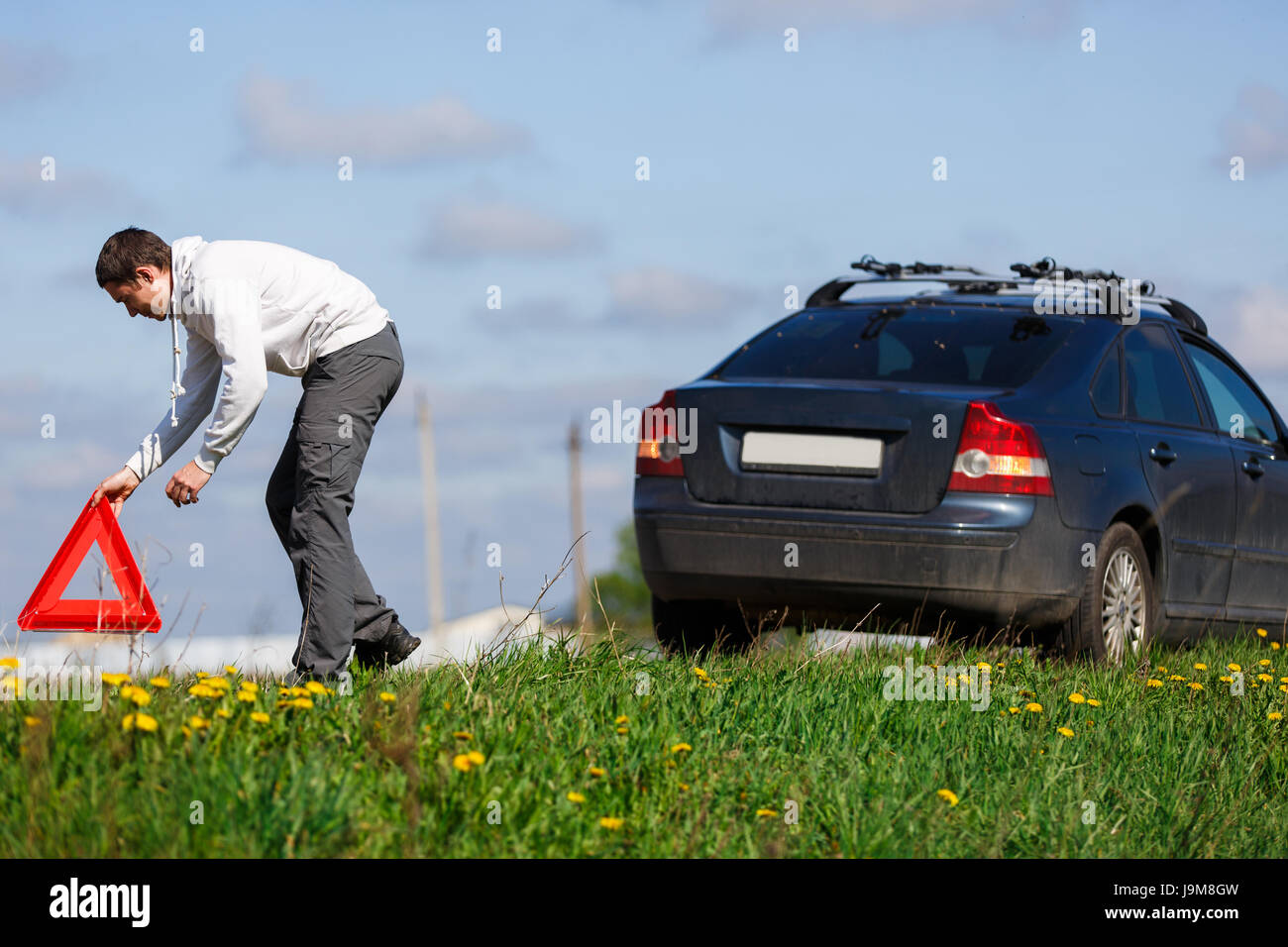 Sad driver puts red sign Stock Photo - Alamy