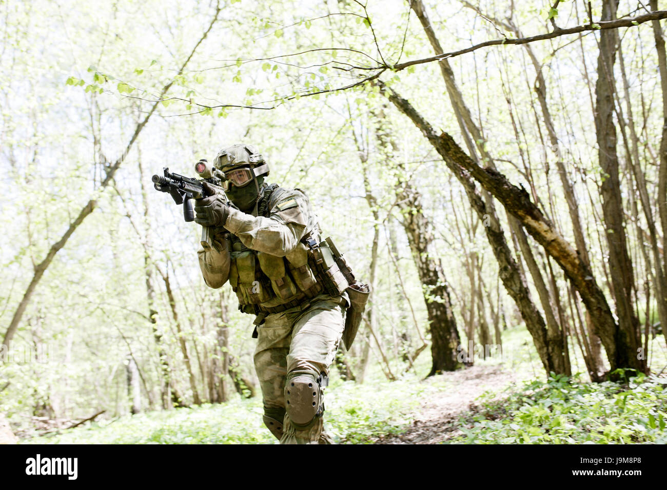 One soldier with submachine gun Stock Photo - Alamy