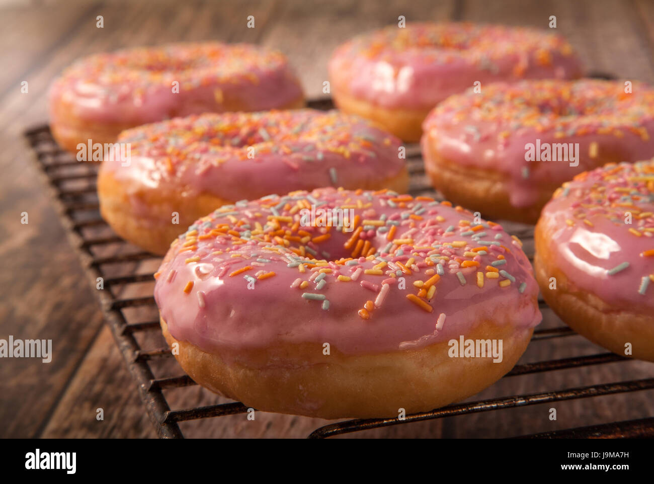 Donuts on cooling rack hi-res stock photography and images - Alamy