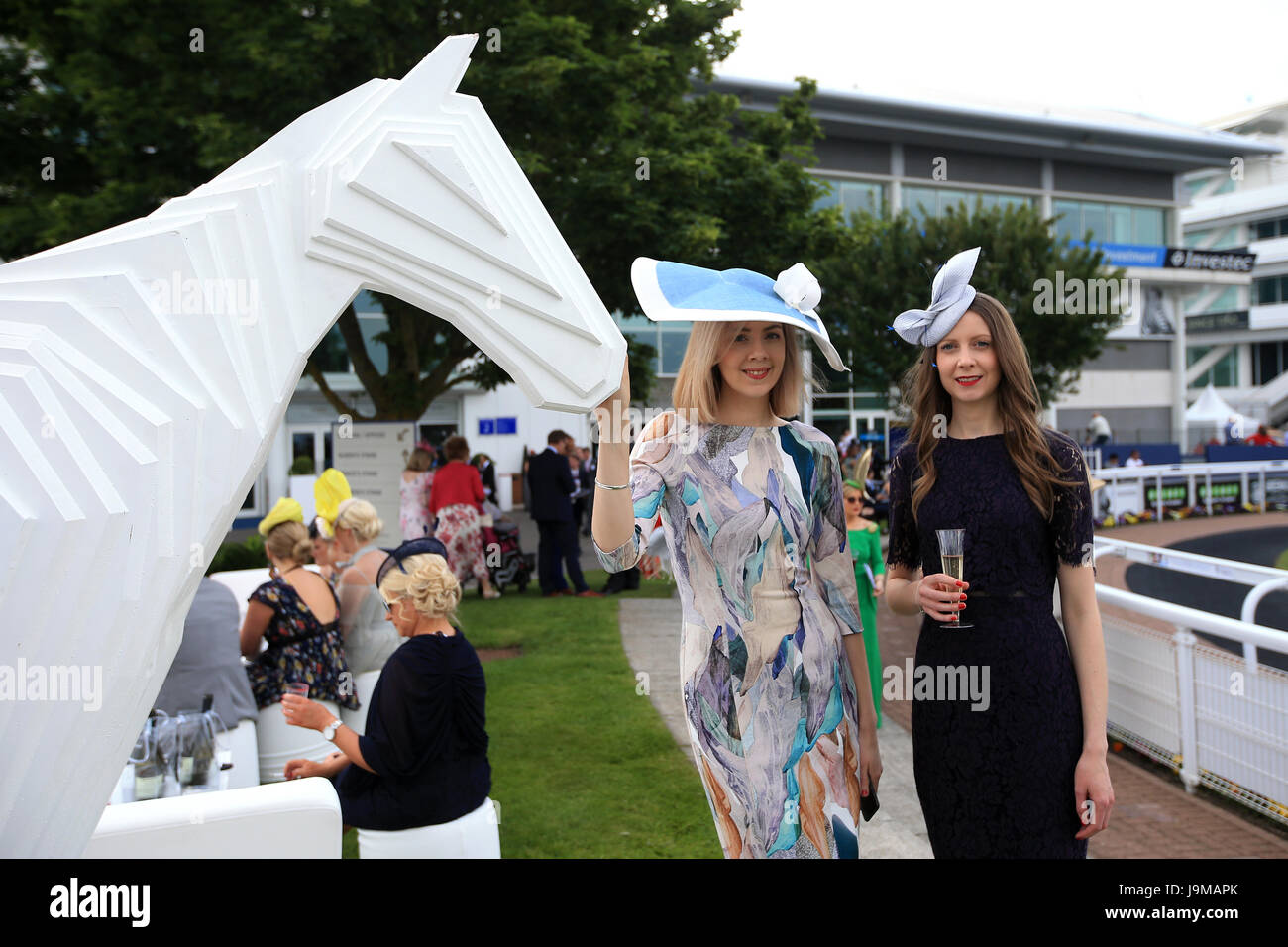 Female racegoers arrive on Ladies Day during the 2017 Investec Epsom ...