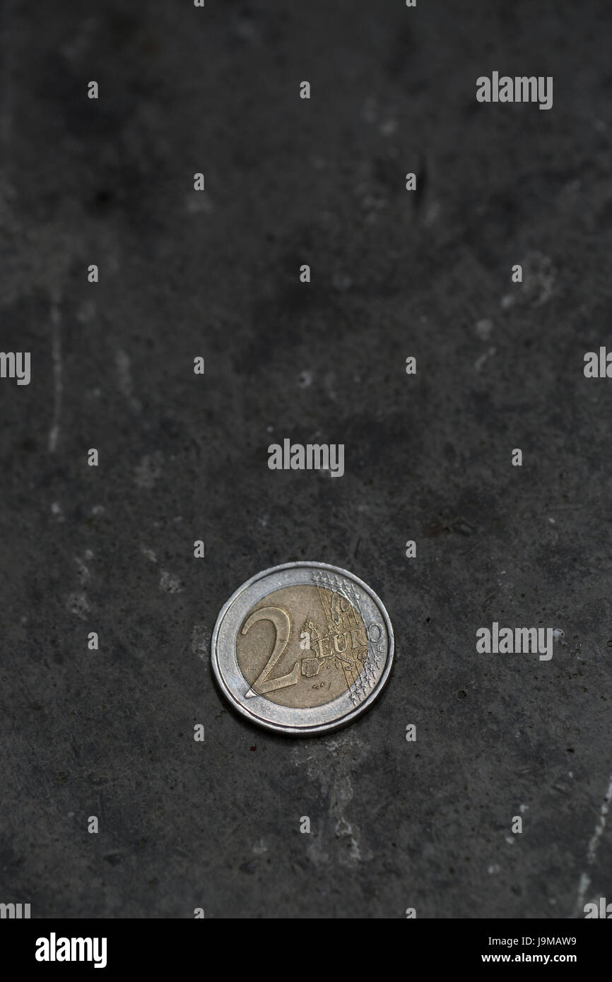 2 euro coin on dark concrete background. Book cover or poster template ...