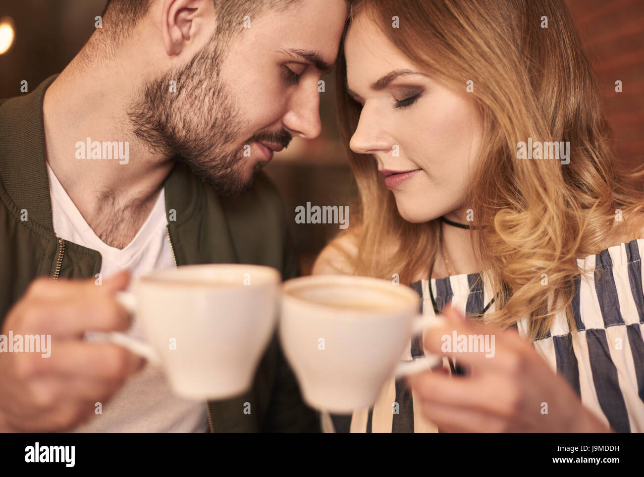 Close up of couple touching forehead Stock Photo - Alamy