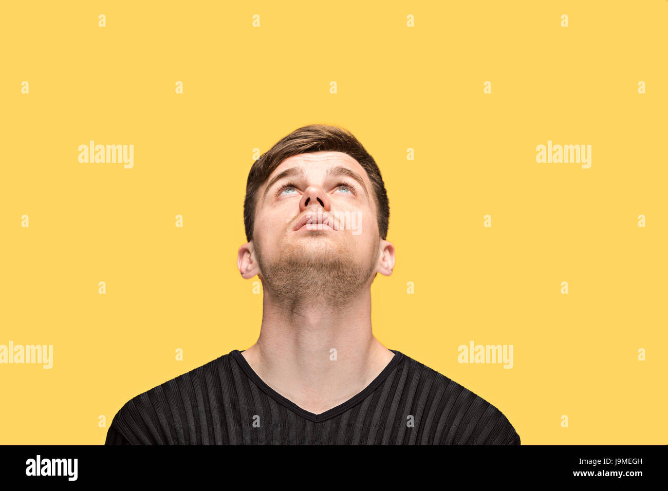 The young man looking up Stock Photo - Alamy