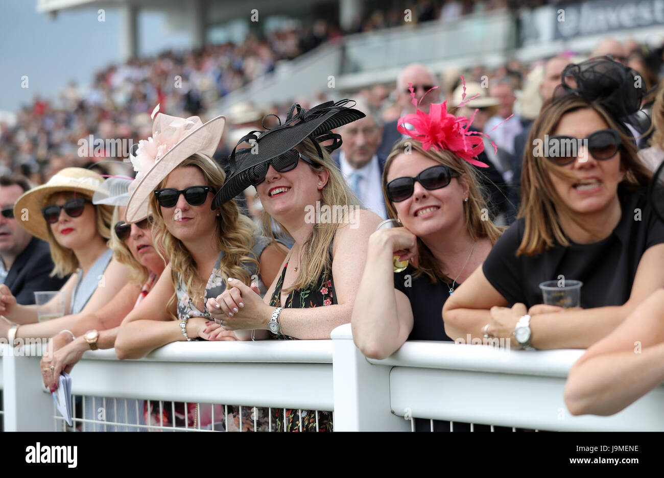 Female racegoers watch the racing action on Ladies Day during the 2017 ...