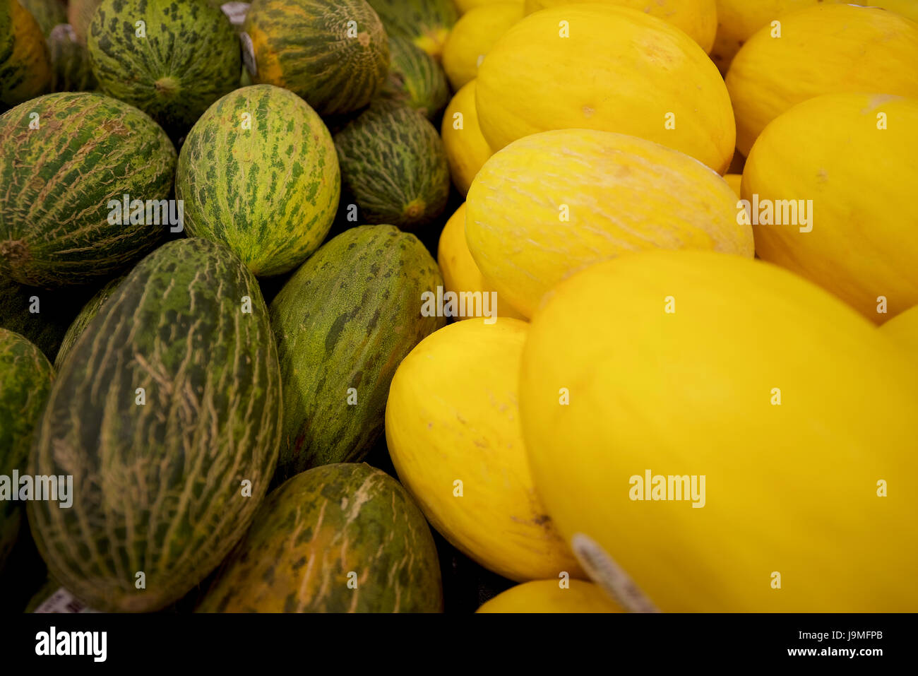 Choice of two melon types for sale at a fruit market Stock Photo - Alamy