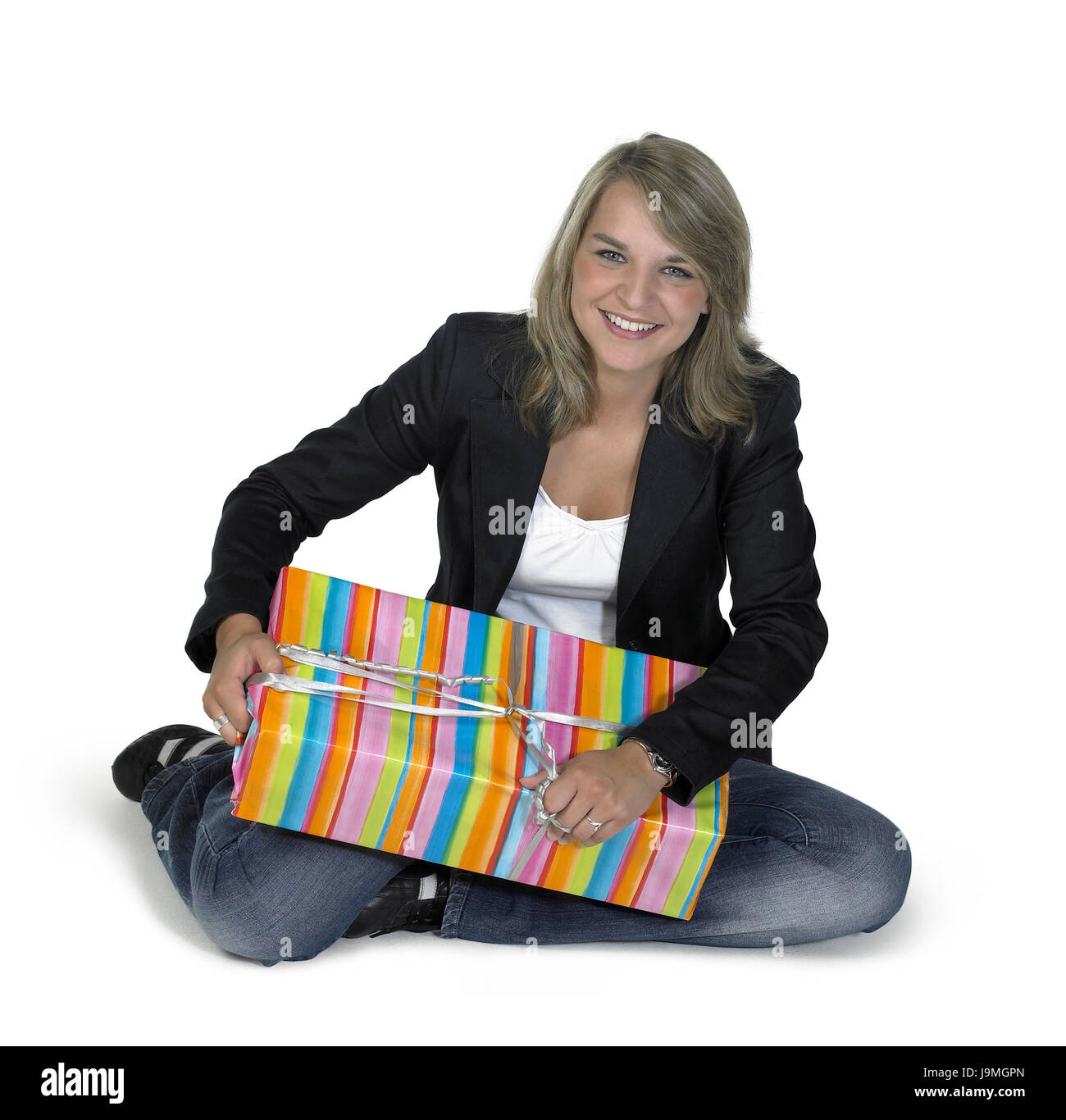 sitting cute girl with present Stock Photo - Alamy