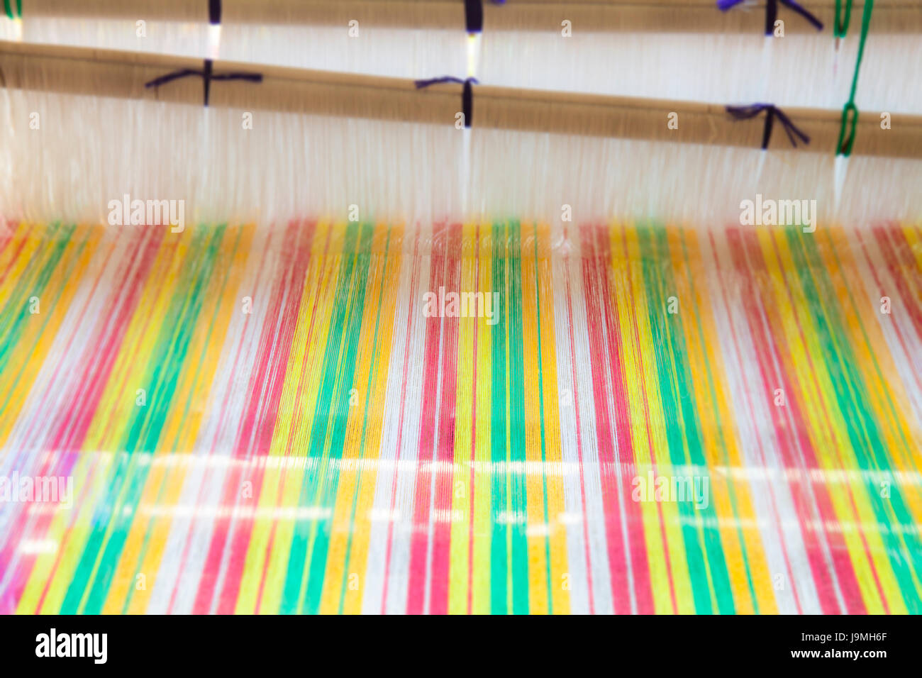 Yarn background, old weaving Loom and thread of yarn. A traditional ...