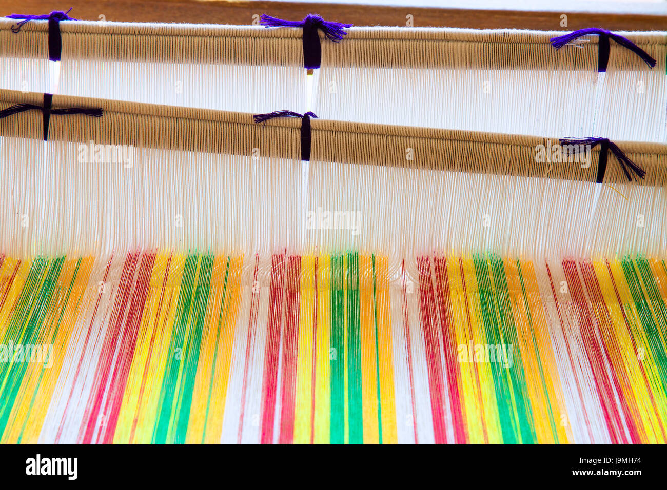 Yarn background, old weaving Loom and thread of yarn. A traditional ...