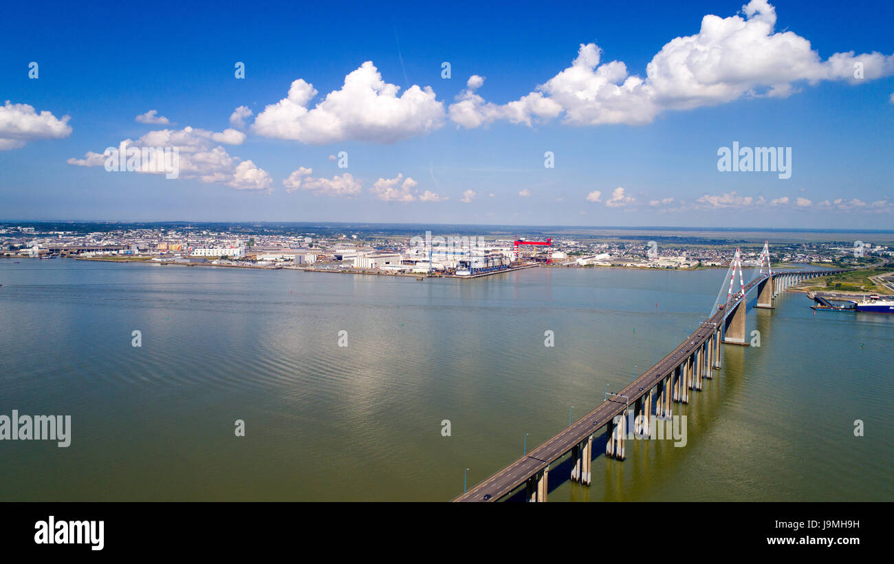 The Saint Nazaire bridge and the Atlantic shipyards in Loire estuary ...