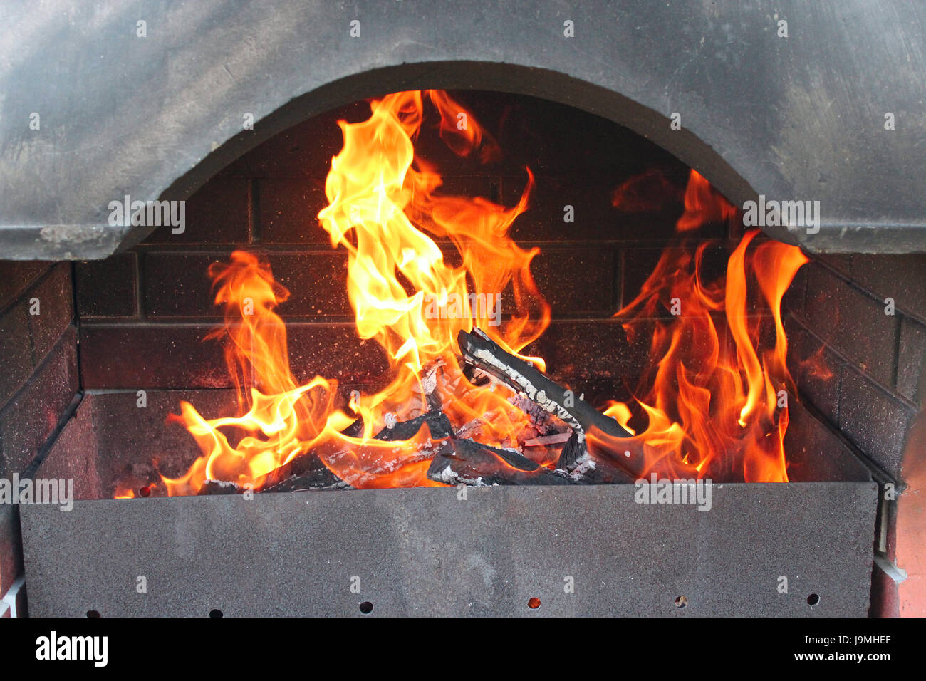 big brazier with burning fire prepared for cooking Stock Photo - Alamy