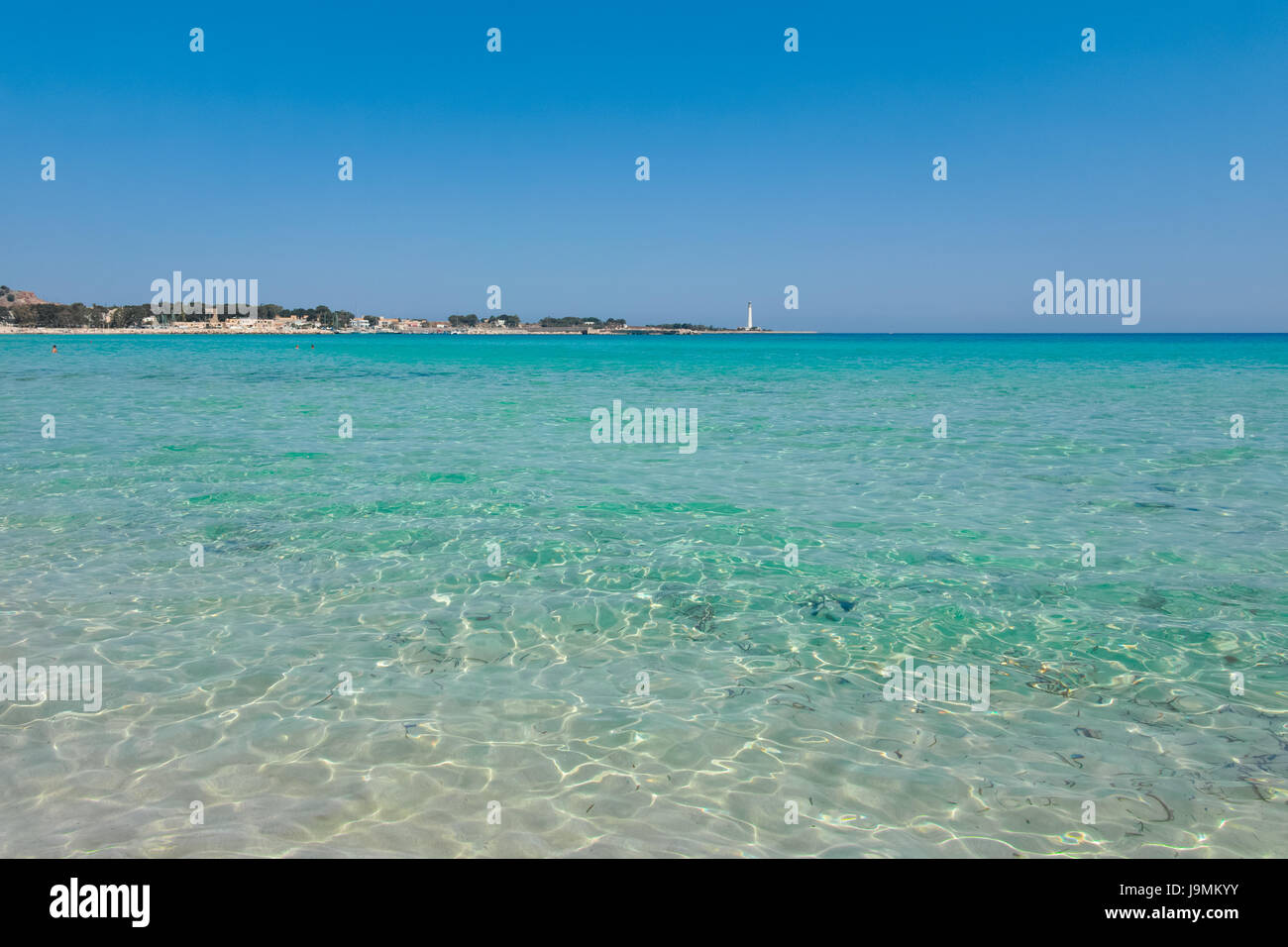 Crystal clear sea water texture with glare from the sun Stock Photo - Alamy