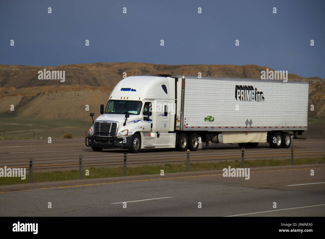 A White Freightliner Semi-Truck Pulls a White "Prime Inc." Trailer ...