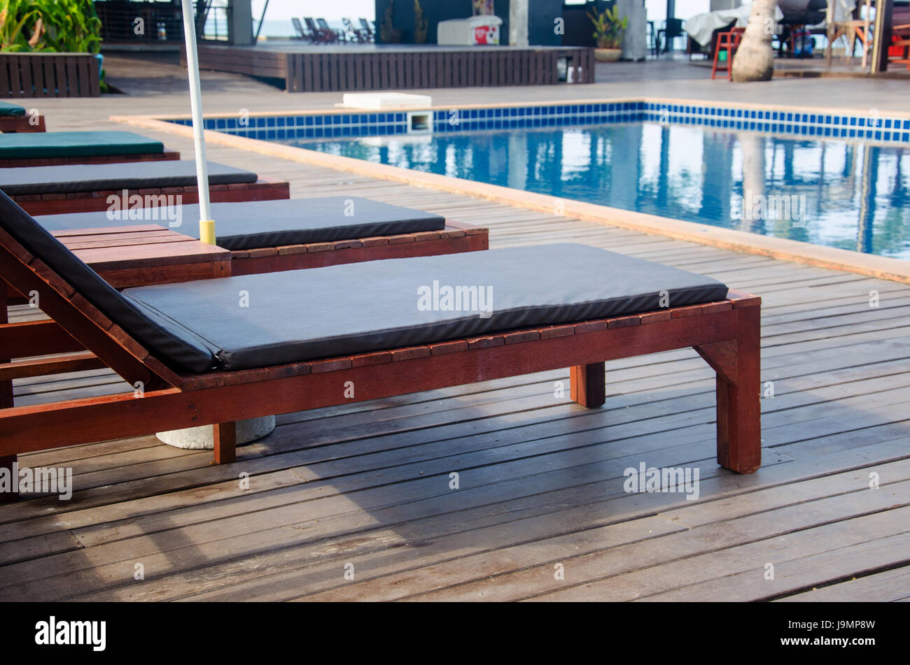 Chairs by the swimming pool Stock Photo - Alamy