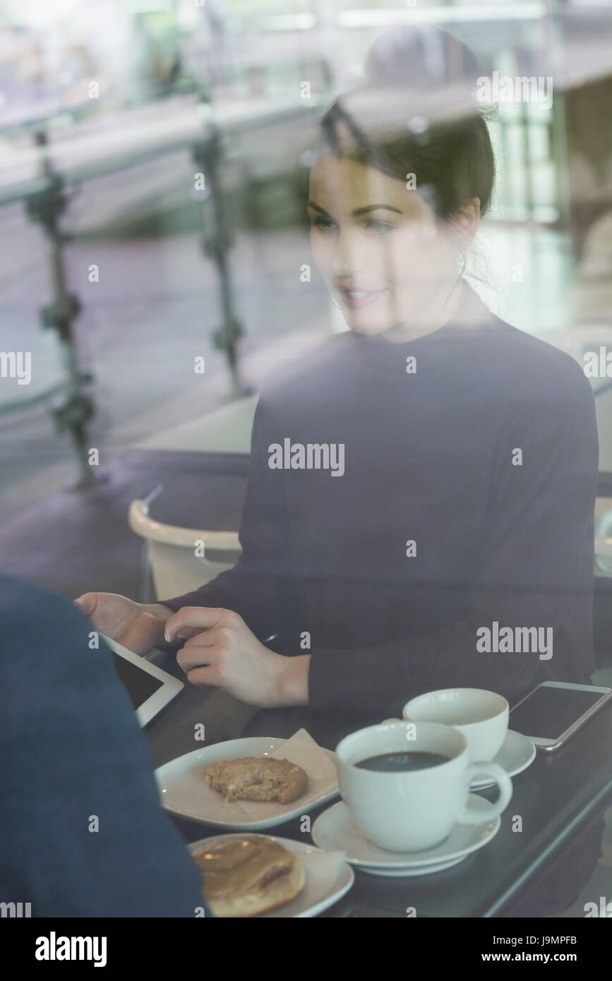Young female executive having breakfast in cafeteria Stock Photo - Alamy