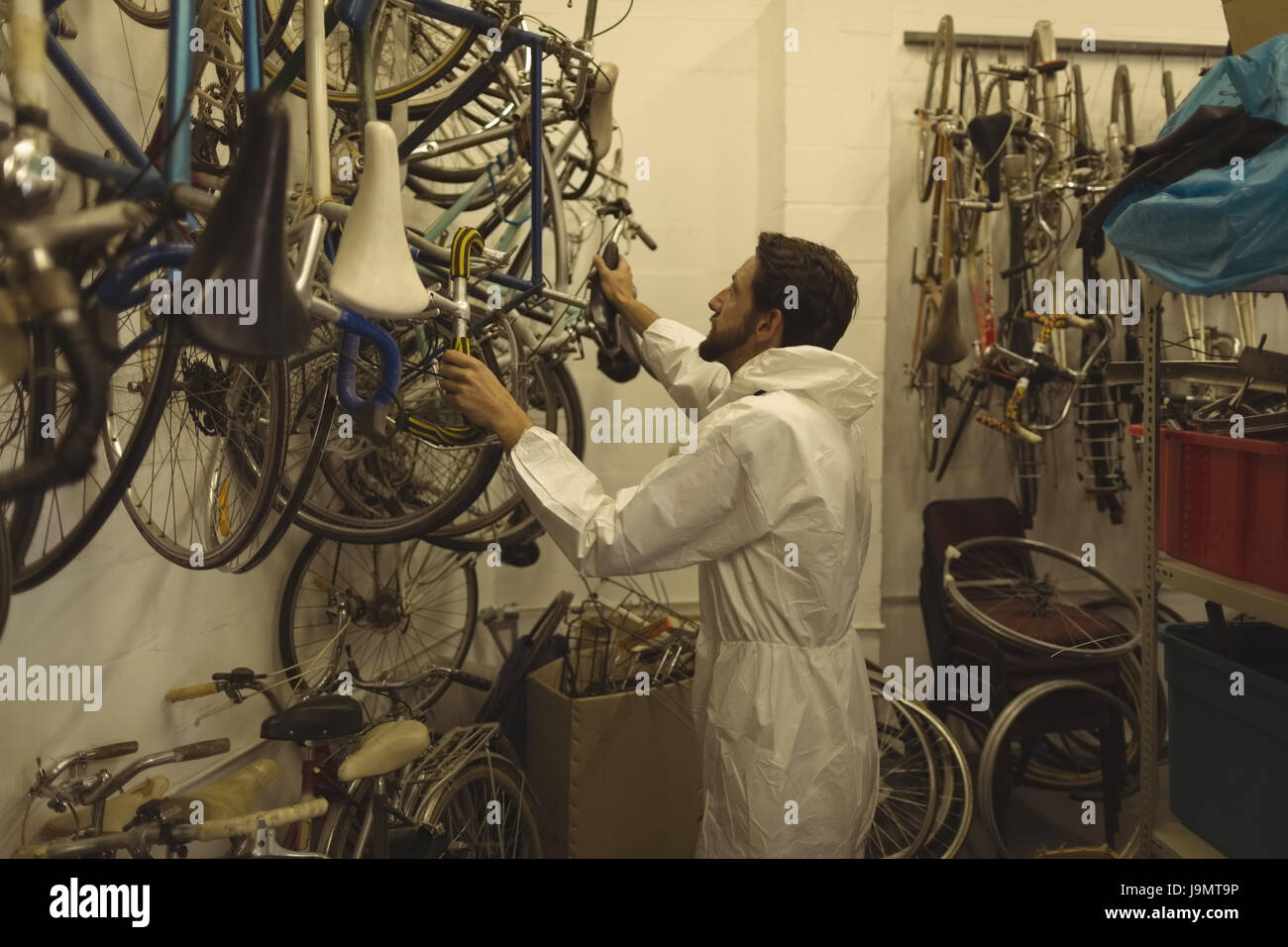 Worker working at vintage bicycle workshop Stock Photo - Alamy
