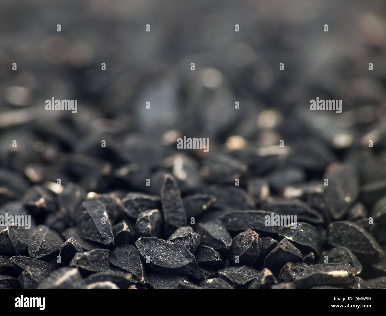 Black bio organic sesame seed macro for background with selective focus ...