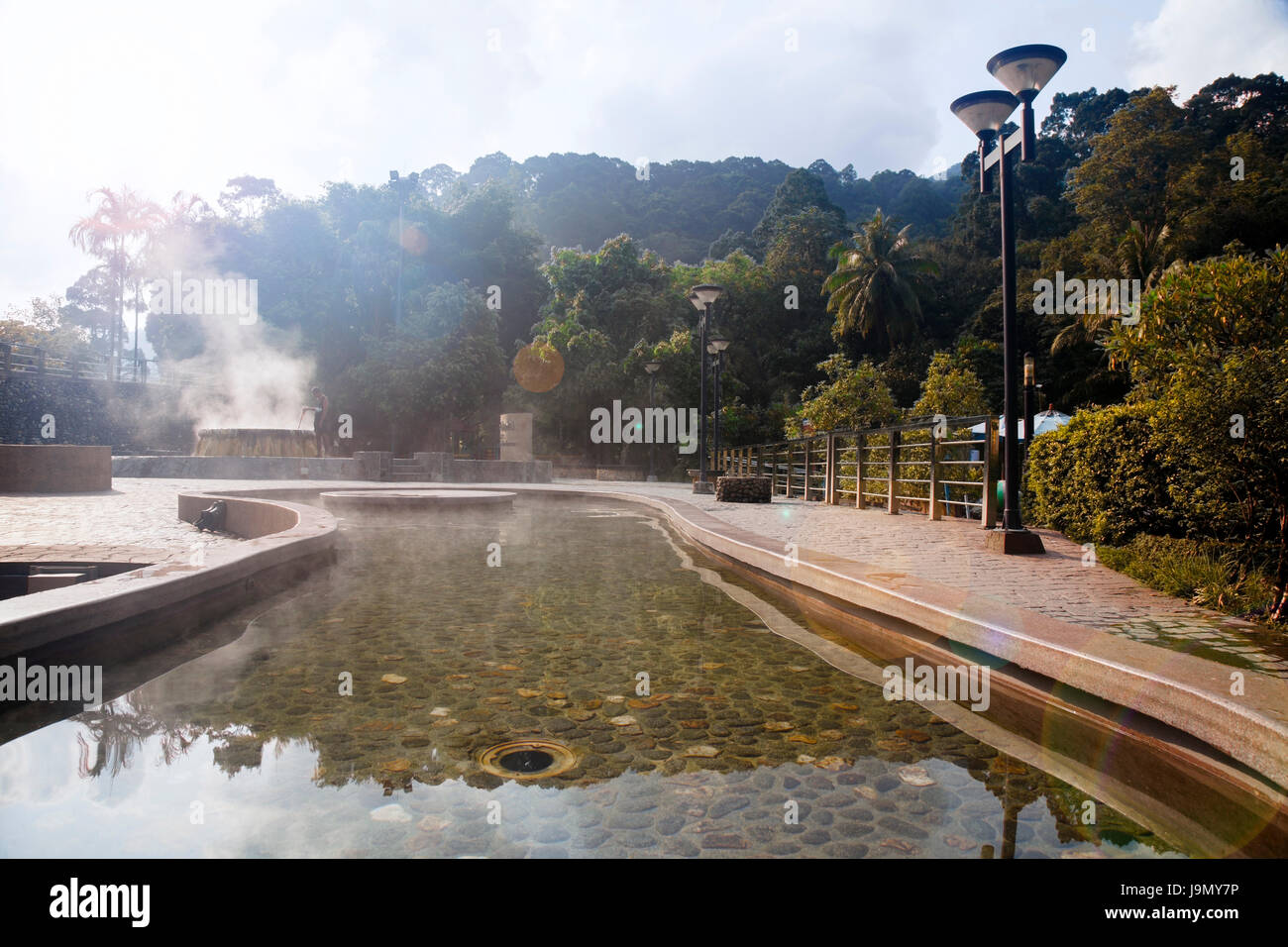 volcanic natural hot spring mineral water pool with steam spa and sun ...