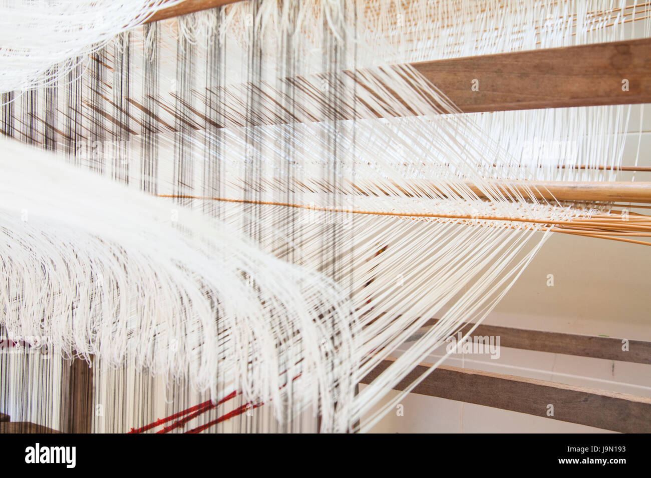 Yarn background, old weaving Loom and thread of yarn. A traditional ...