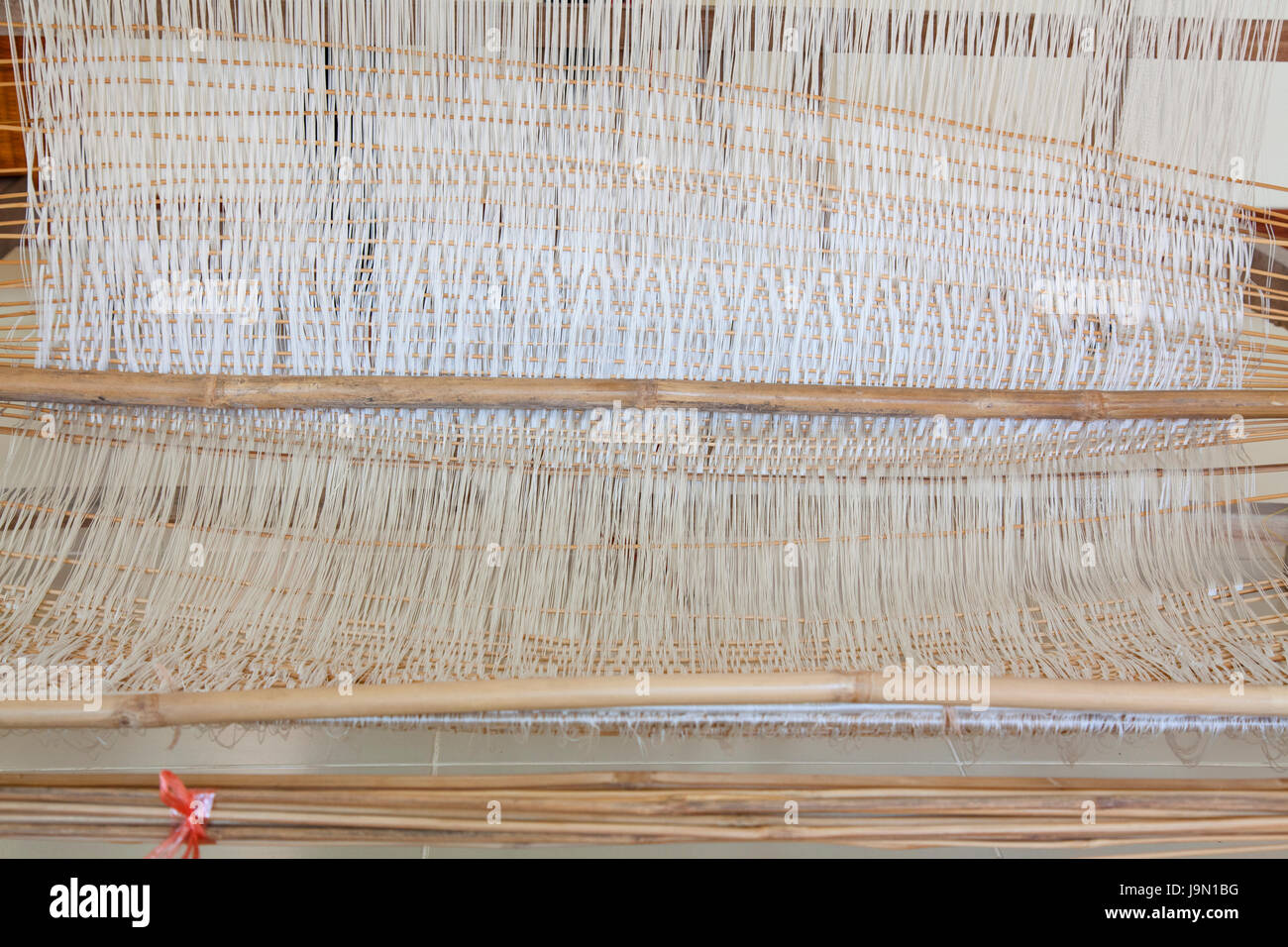 Yarn background, old weaving Loom and thread of yarn. A traditional ...