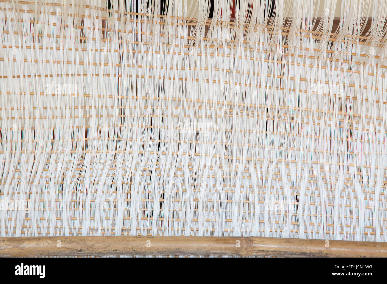 Yarn background, old weaving Loom and thread of yarn. A traditional ...