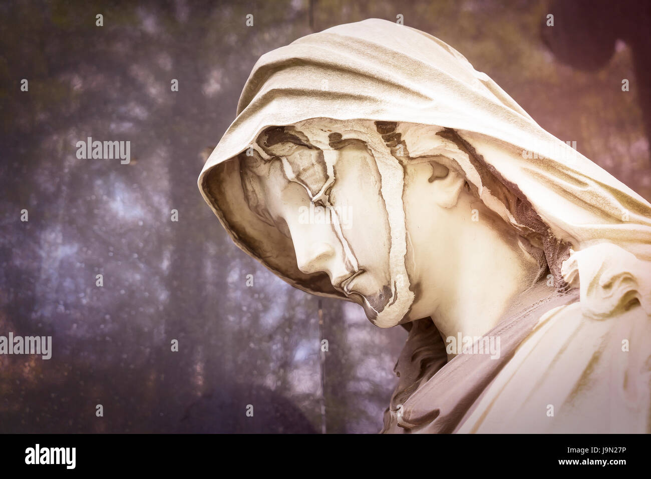 close up of an old sculpture of a sad woman. Unknown artist of the 19rh ...