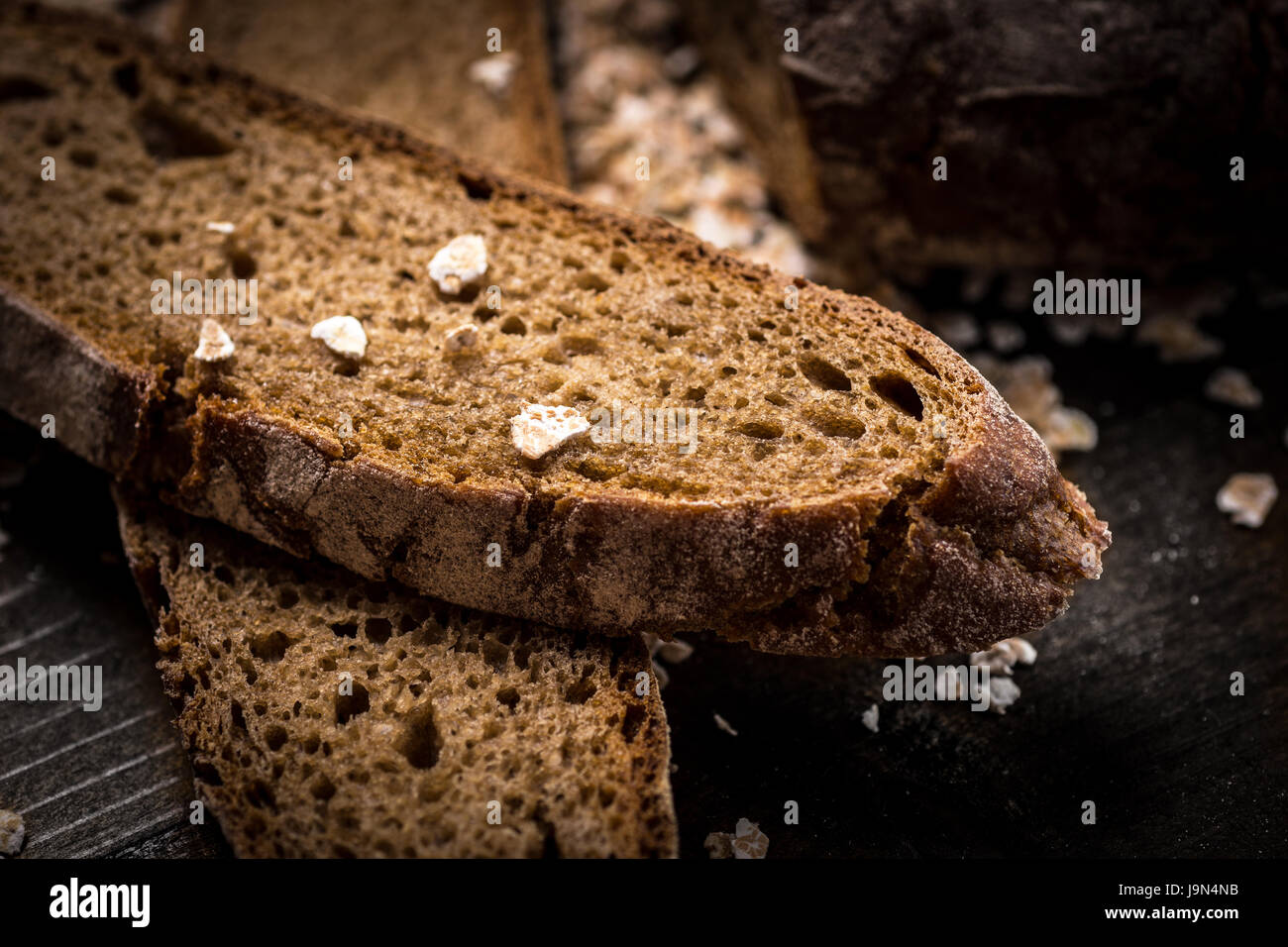 Traditional Whole Grain Rye Bread on Dark Wooden Table Background Stock ...