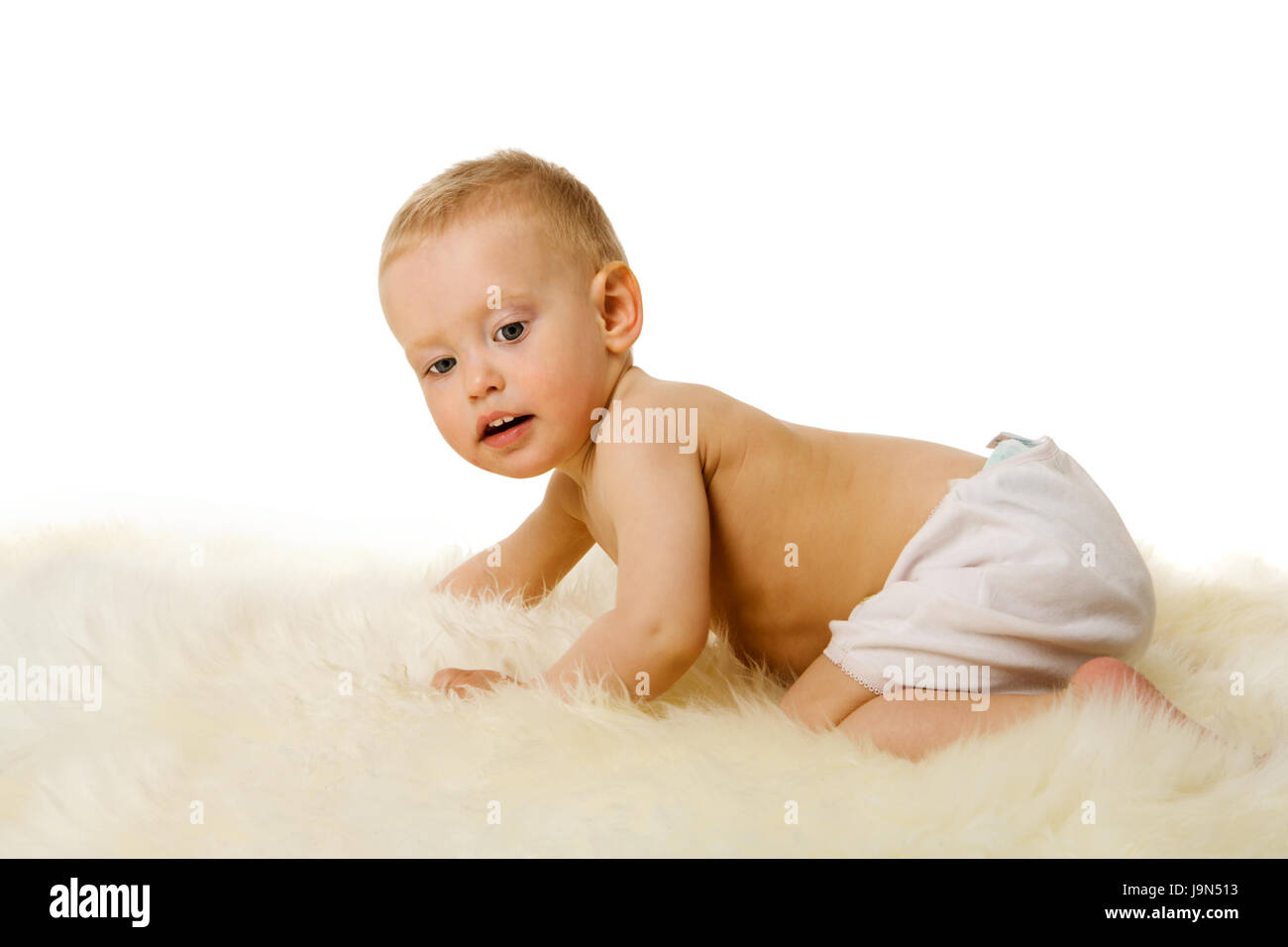 Toddler girl crawling wearing diaper isolated on white Stock Photo - Alamy