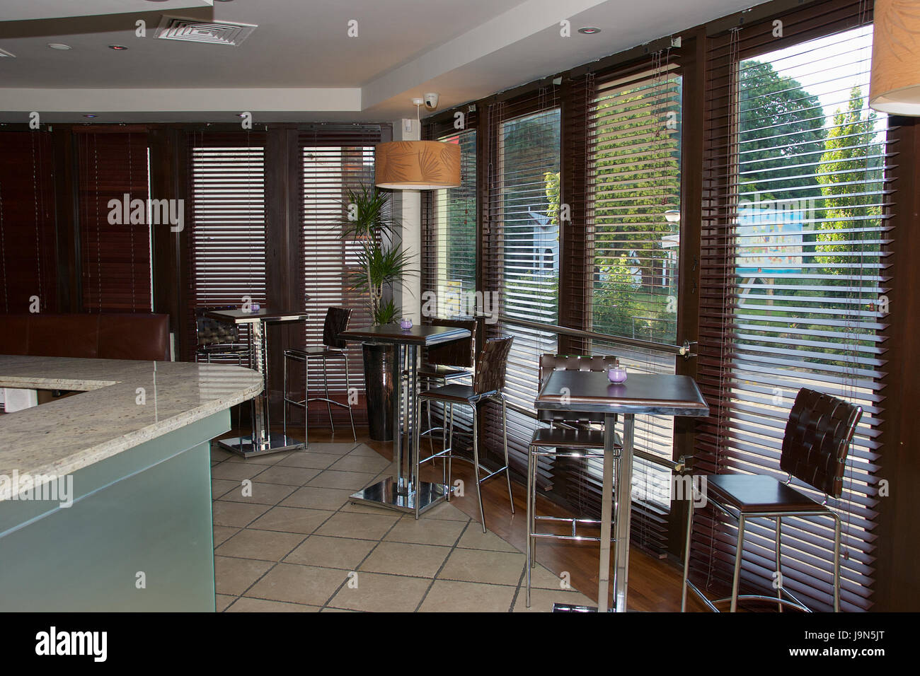 Interior of a bar/cafe with stools and tables Stock Photo - Alamy