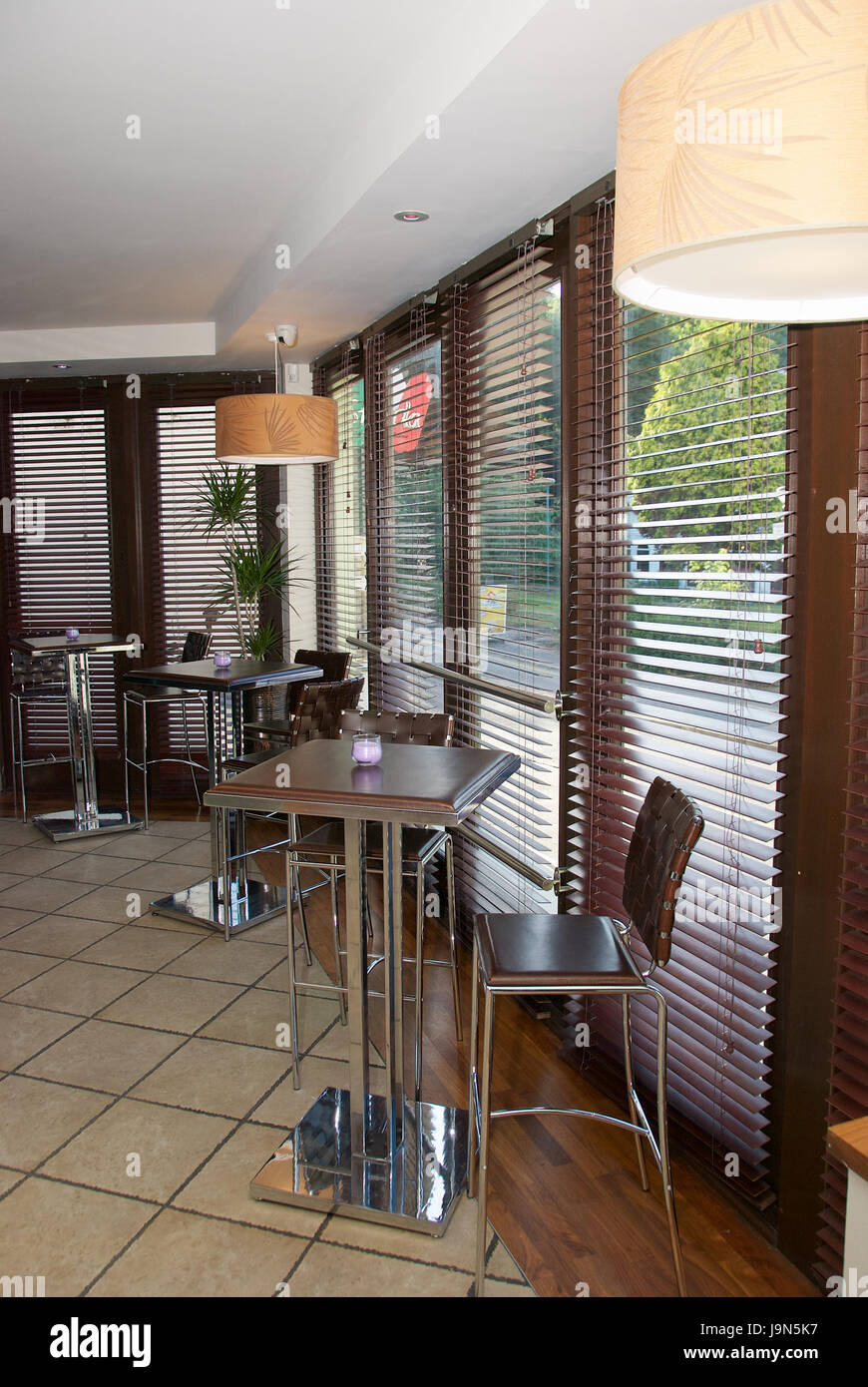Interior of a bar/cafe with stools and tables Stock Photo - Alamy